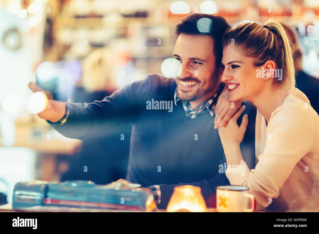 Couple restaurant romantic phone hi-res stock photography and images ...
