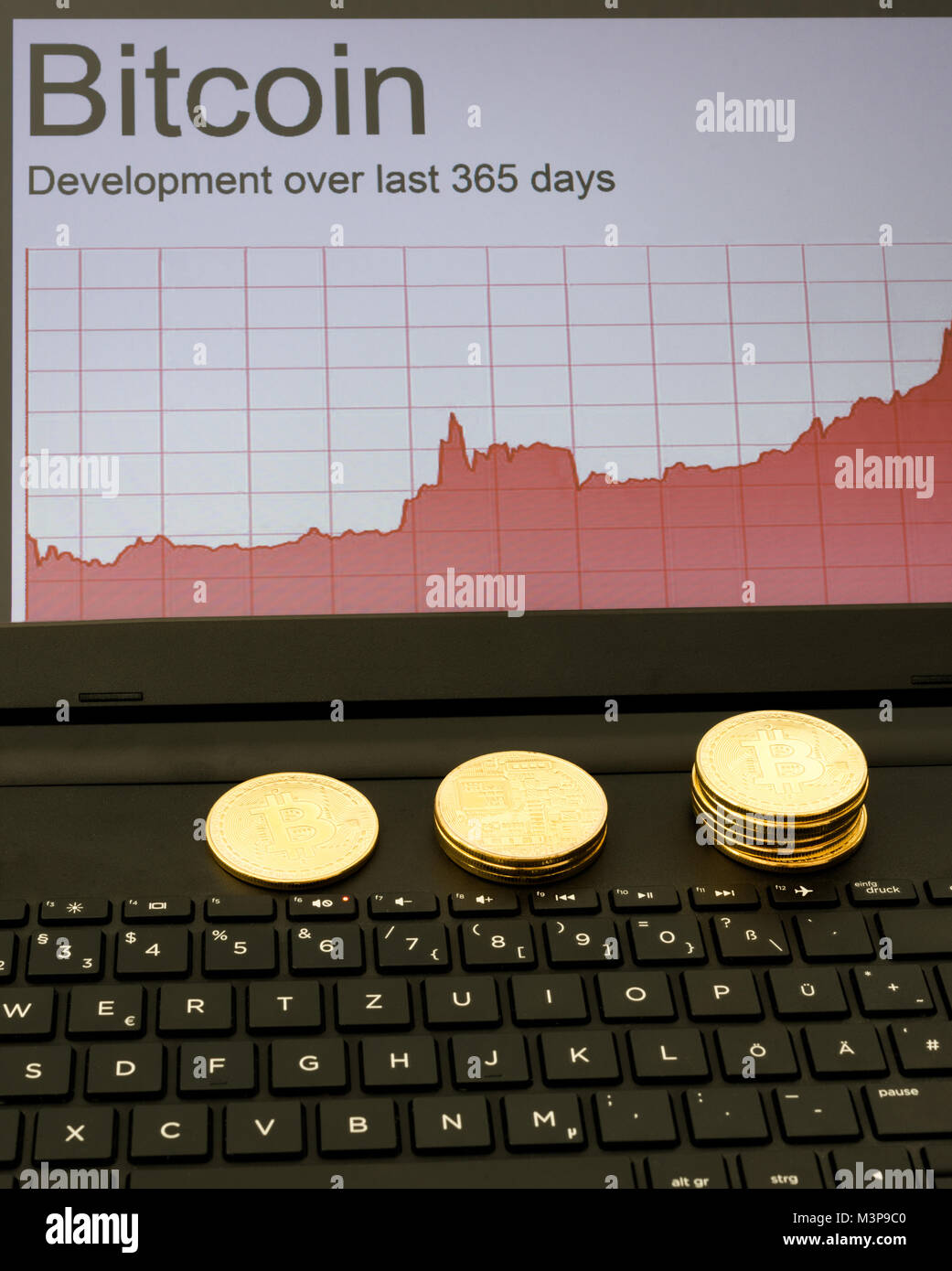 Bitcoins and rising chart on laptop computer Stock Photo - Alamy