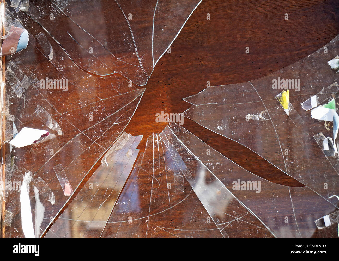 Broken shopwindow closeup in summer Stock Photo - Alamy
