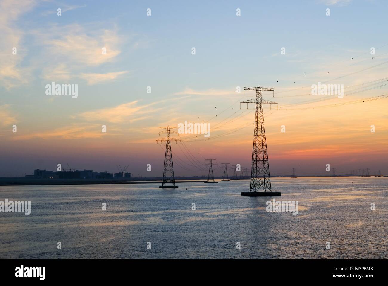 High voltage Electricty Power lines distributed through Ocean with ...
