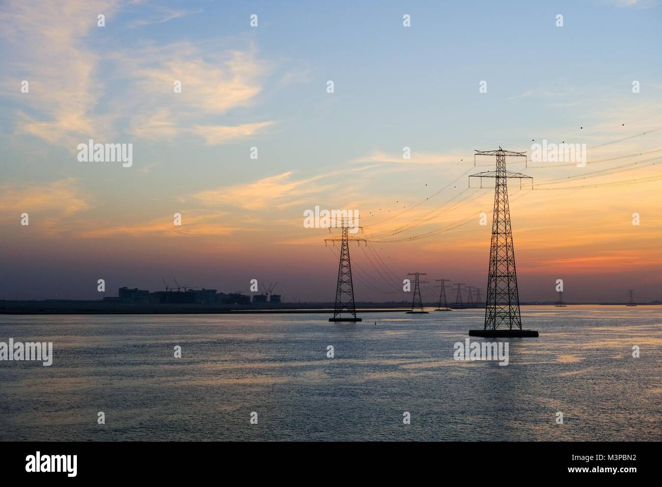 High voltage Electricty Power lines distributed through Ocean with ...