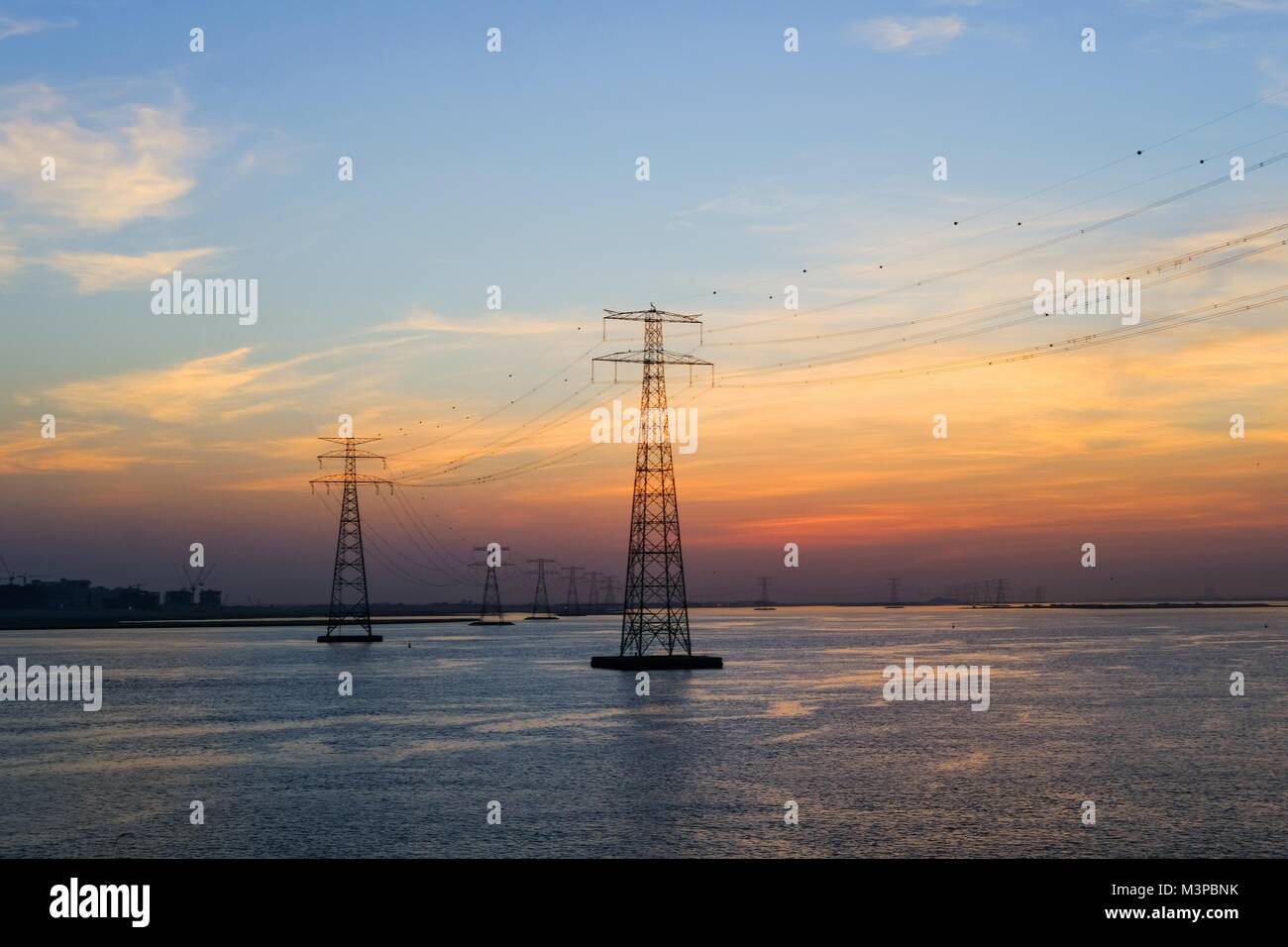 High voltage Electricty Power lines distributed through Ocean with ...