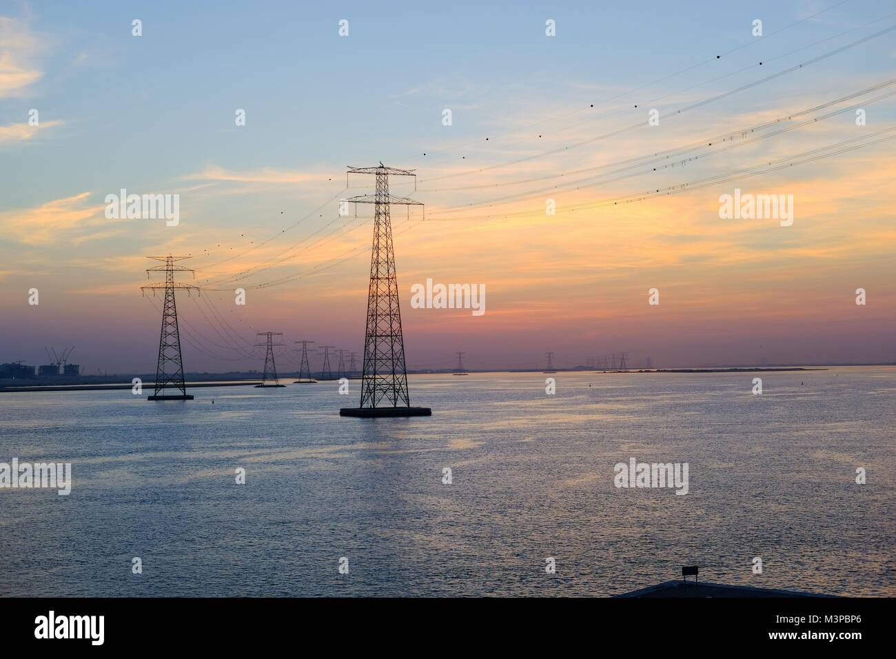 High voltage Electricty Power lines distributed through Ocean with ...