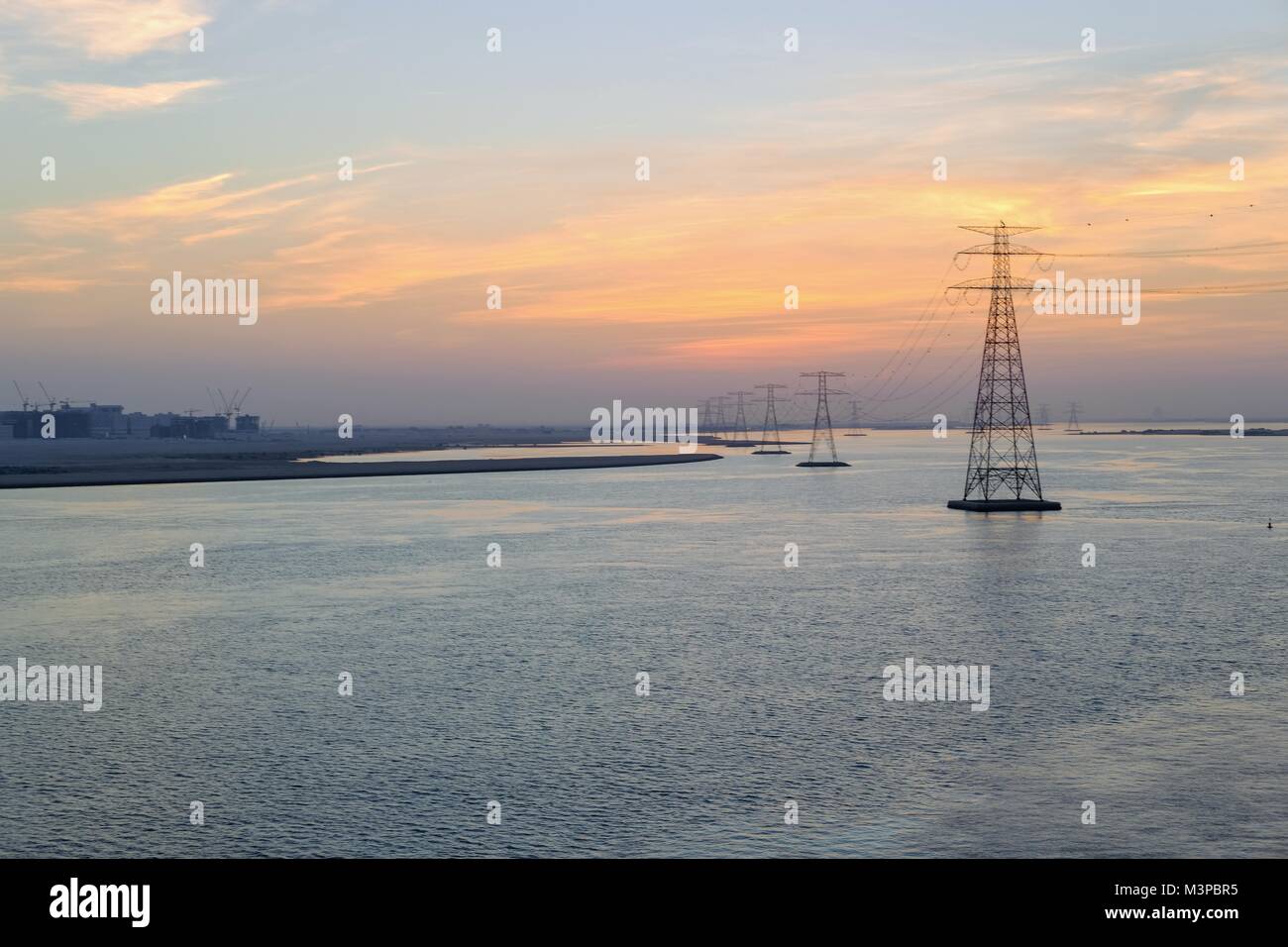 High voltage Electricty Power lines distributed through Ocean with ...