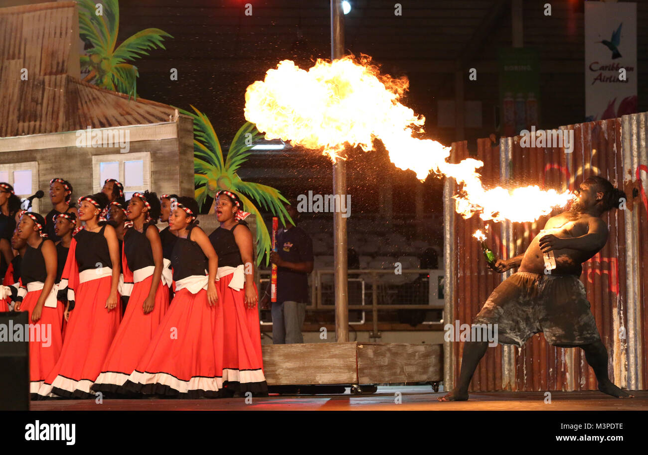 Trinidad, Port of Spain. 11th Feb, 2018. Singers and a traditional mas ...