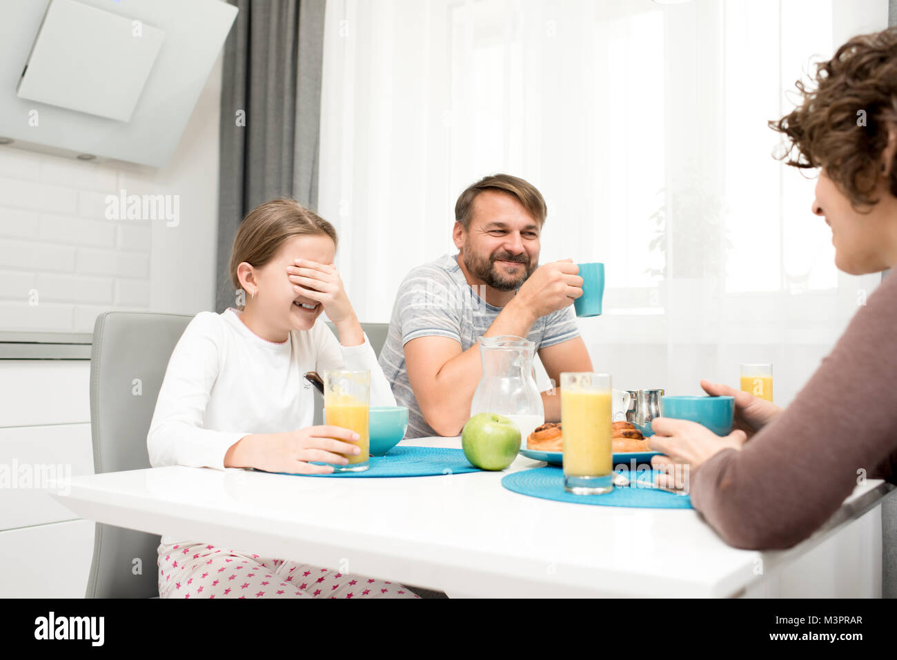 Loving Family at Breakfast Stock Photo - Alamy