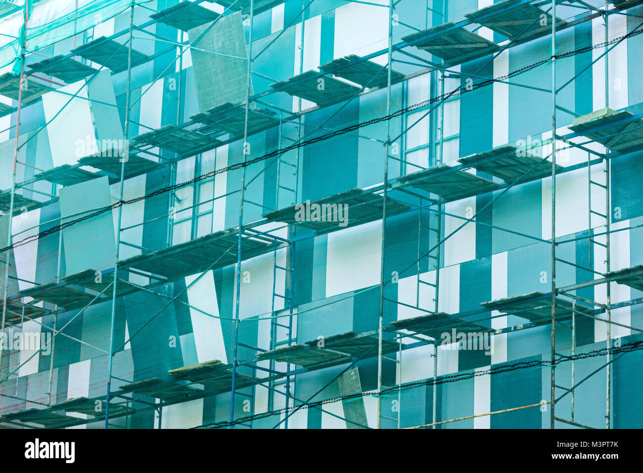 scaffolding on building facade. fall-protection safety net. building ...