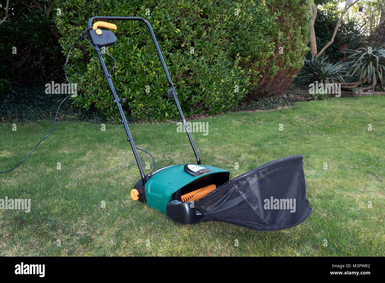 Electric garden lawn raker Stock Photo - Alamy