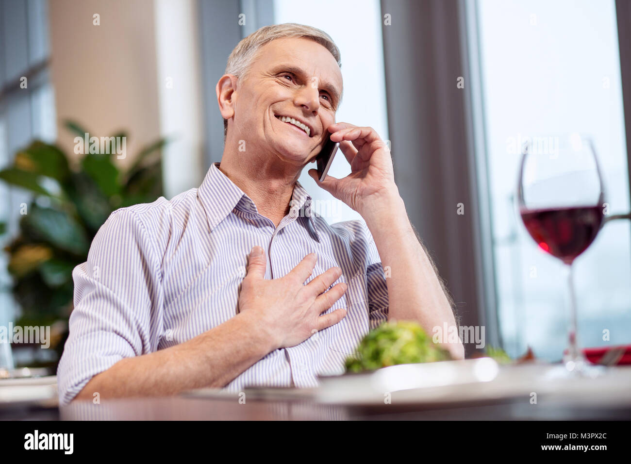 Senior man receiving phone call hi-res stock photography and images - Alamy