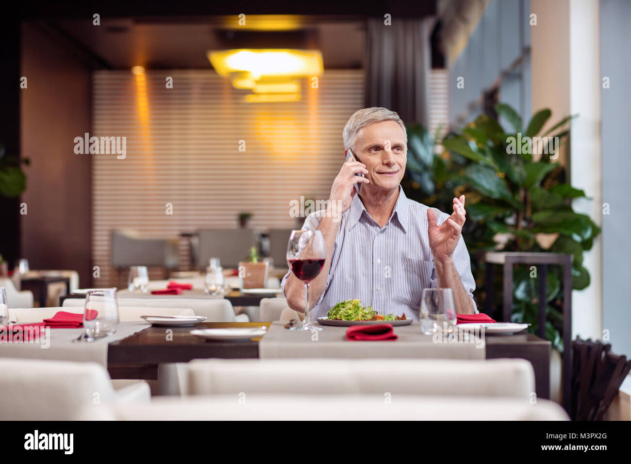 Senior man receiving phone call hi-res stock photography and images - Alamy