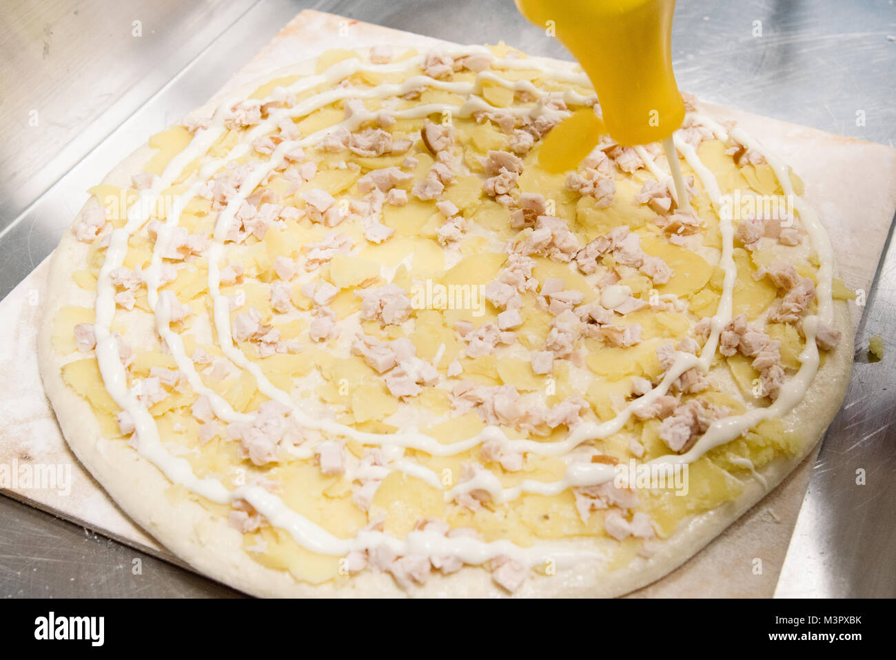 Process of making, decorating, preparing pizza. Restaurant or cafe ...