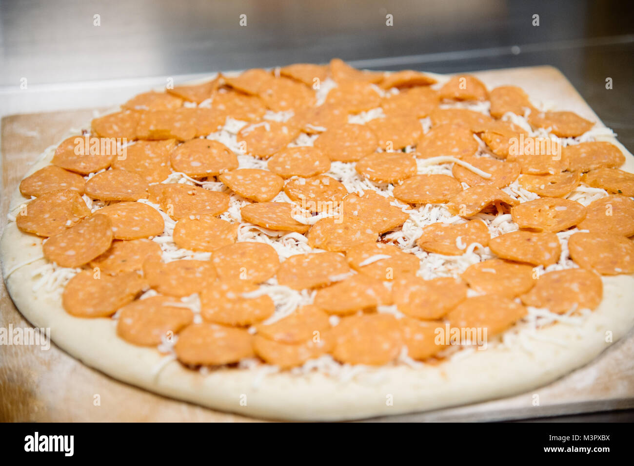 Process of making, decorating, preparing pizza. Restaurant or cafe ...
