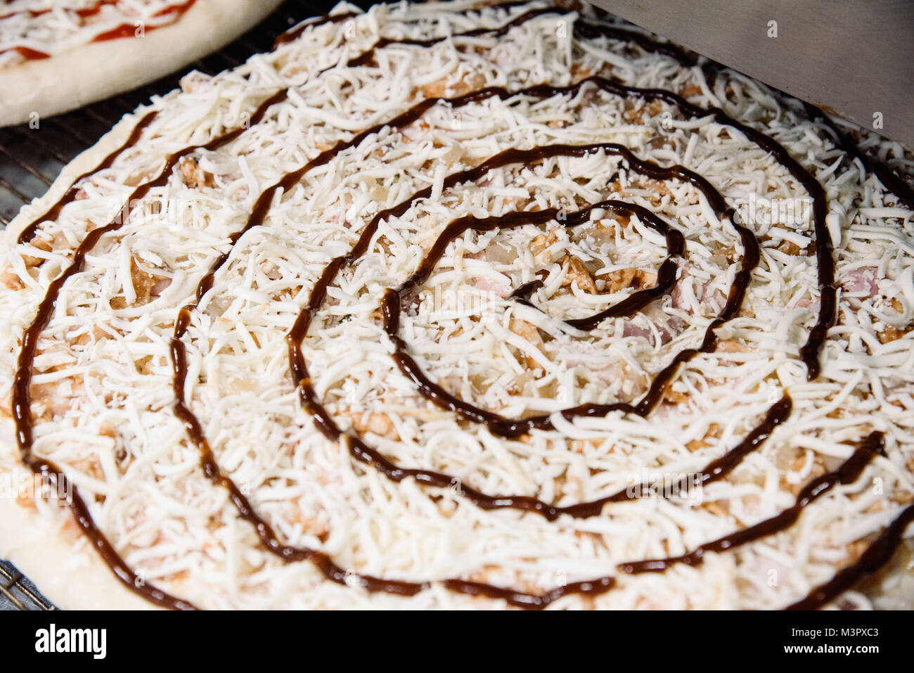 Restaurant kitchen chef decorating pizza hi-res stock photography and ...