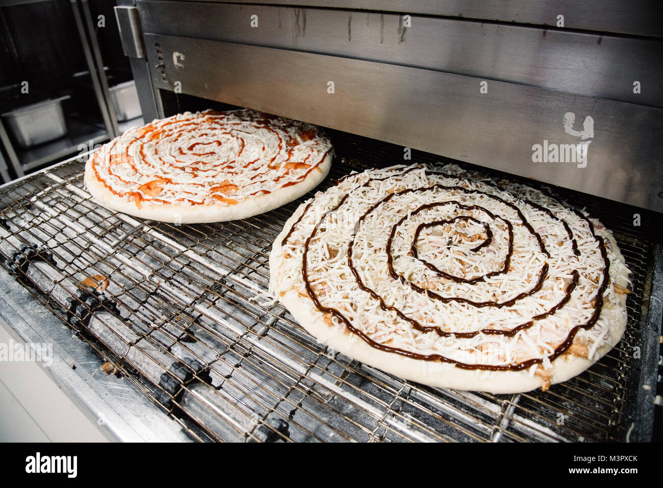 Process of cooking, making, baking pizza on grill. Restaurant, cafe or ...