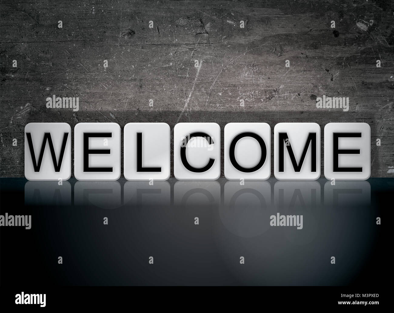 The word Welcome concept and theme written in white tiles on a dark ...