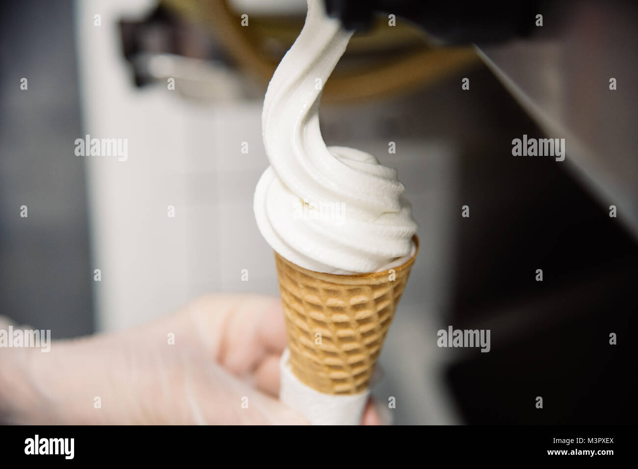 Industrial preparation of creamy ice cream on the kitchen Stock Photo ...