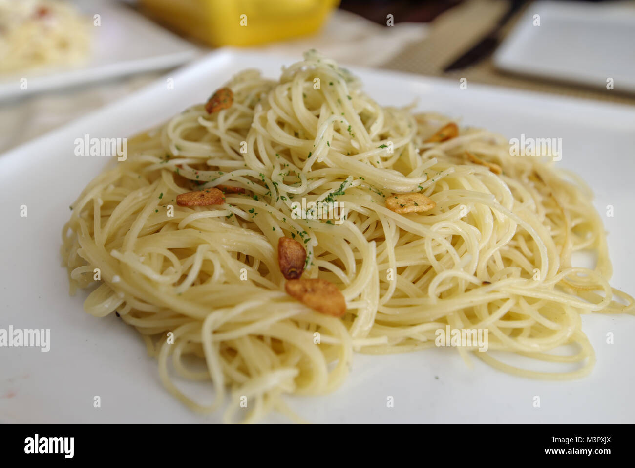 oil base pasta Spaghetti Aglio on the table, Manila Stock Photo - Alamy
