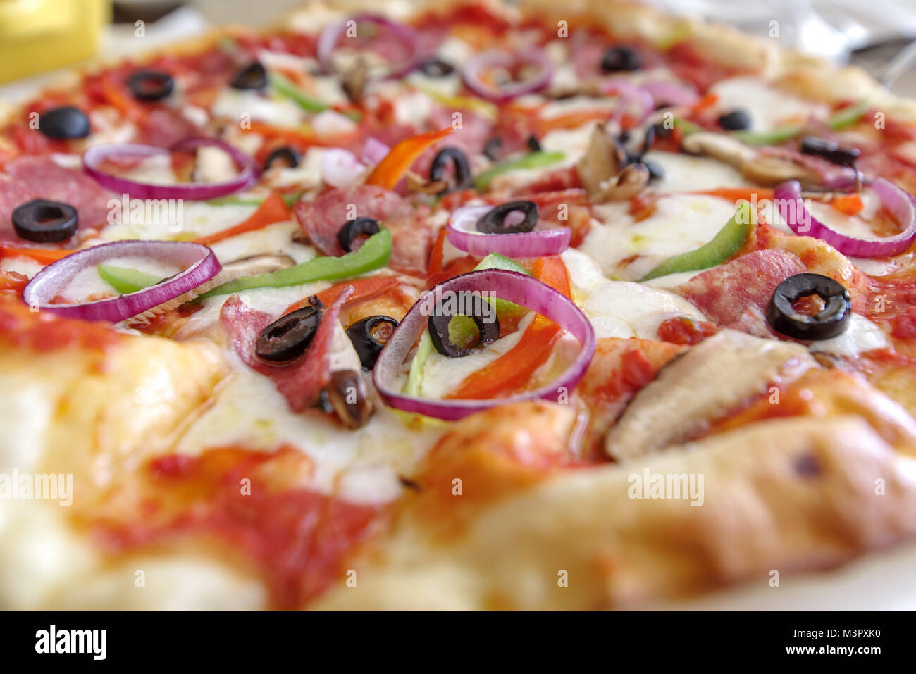Italian style thin pizza on the table, Manila Stock Photo - Alamy