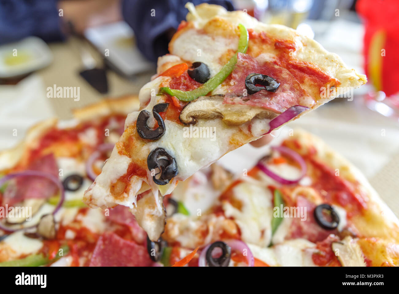 Italian style thin pizza on the table, Manila Stock Photo - Alamy