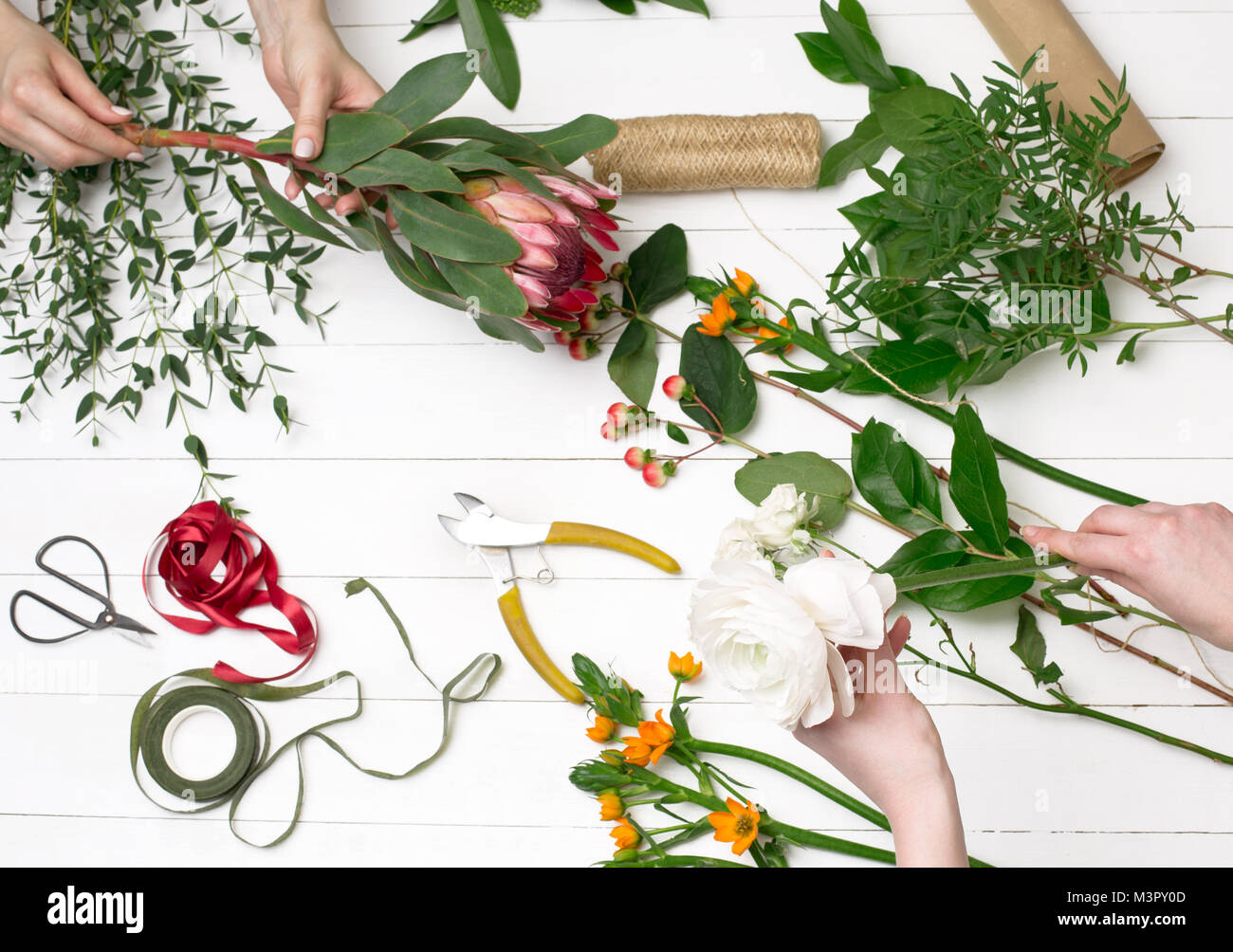 Female florist making beautiful bouquet at flower shop Stock Photo - Alamy