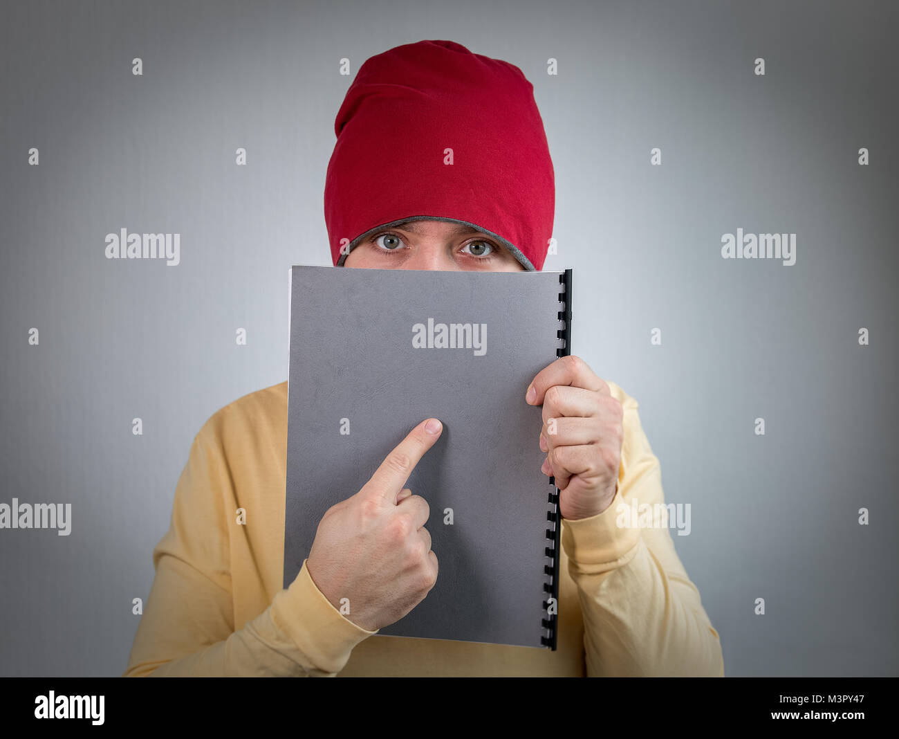 Man holding gray notebook, free space for marketing information text ...