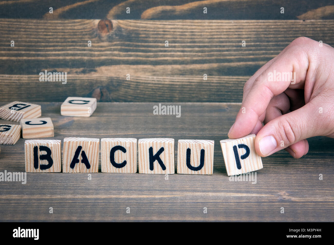 backup. Wooden letters on the office desk, informative and ...