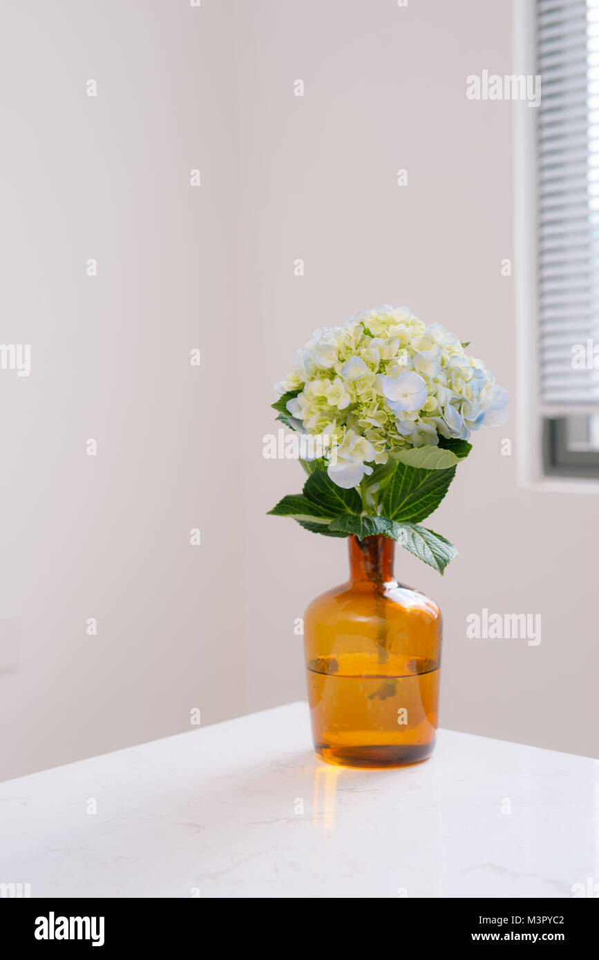 Beautiful spring flowers in vase on window background Stock Photo - Alamy