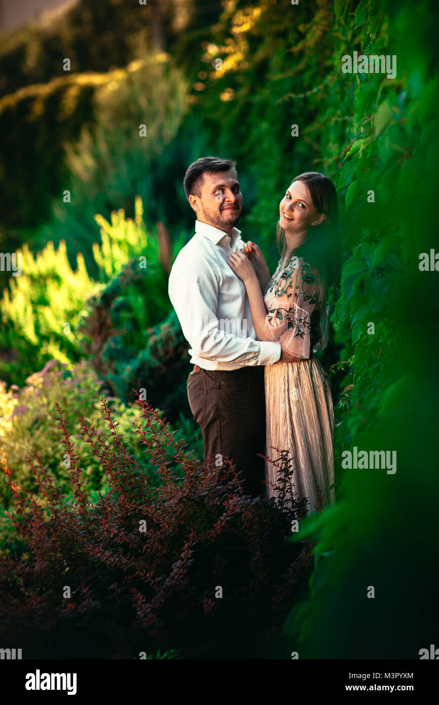 Beautiful young couple on a nature background Stock Photo - Alamy