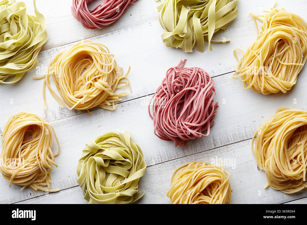 Several types of italian pasta on white wooden background Stock Photo ...