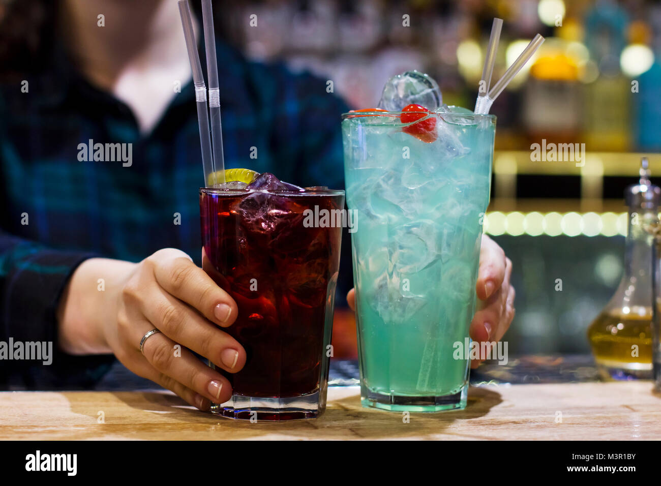 Bartender pouring cocktails on counter hi-res stock photography and ...