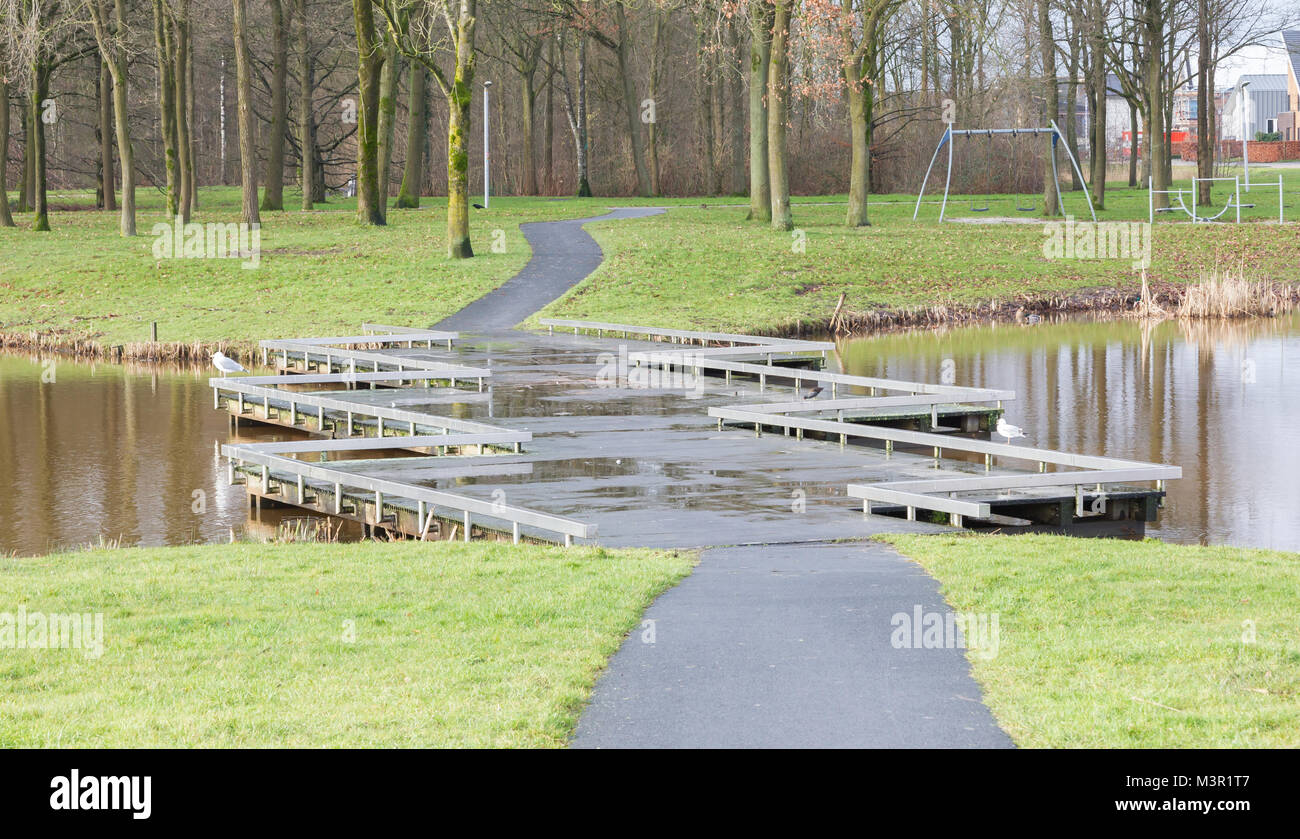 Unique bridge over a pond in the Netherlands Stock Photo - Alamy