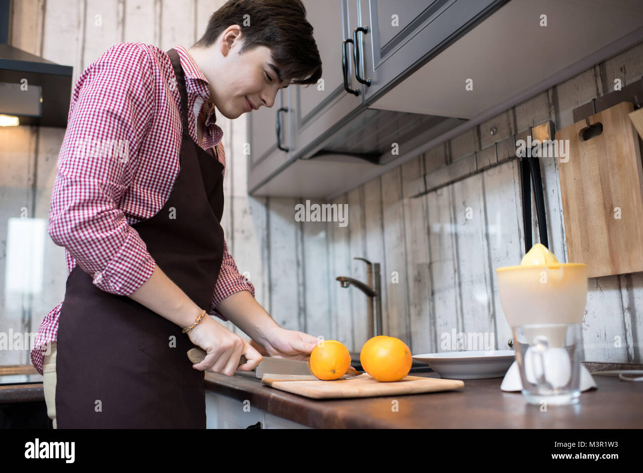 Teenager cooking apron hi-res stock photography and images - Alamy