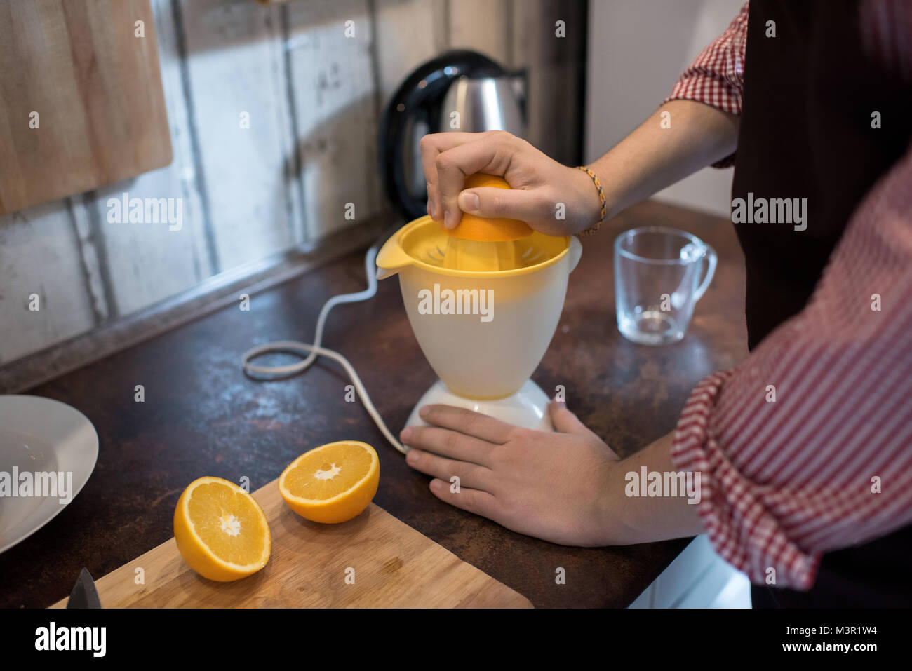Man Making Orange Juice Stock Photo - Alamy