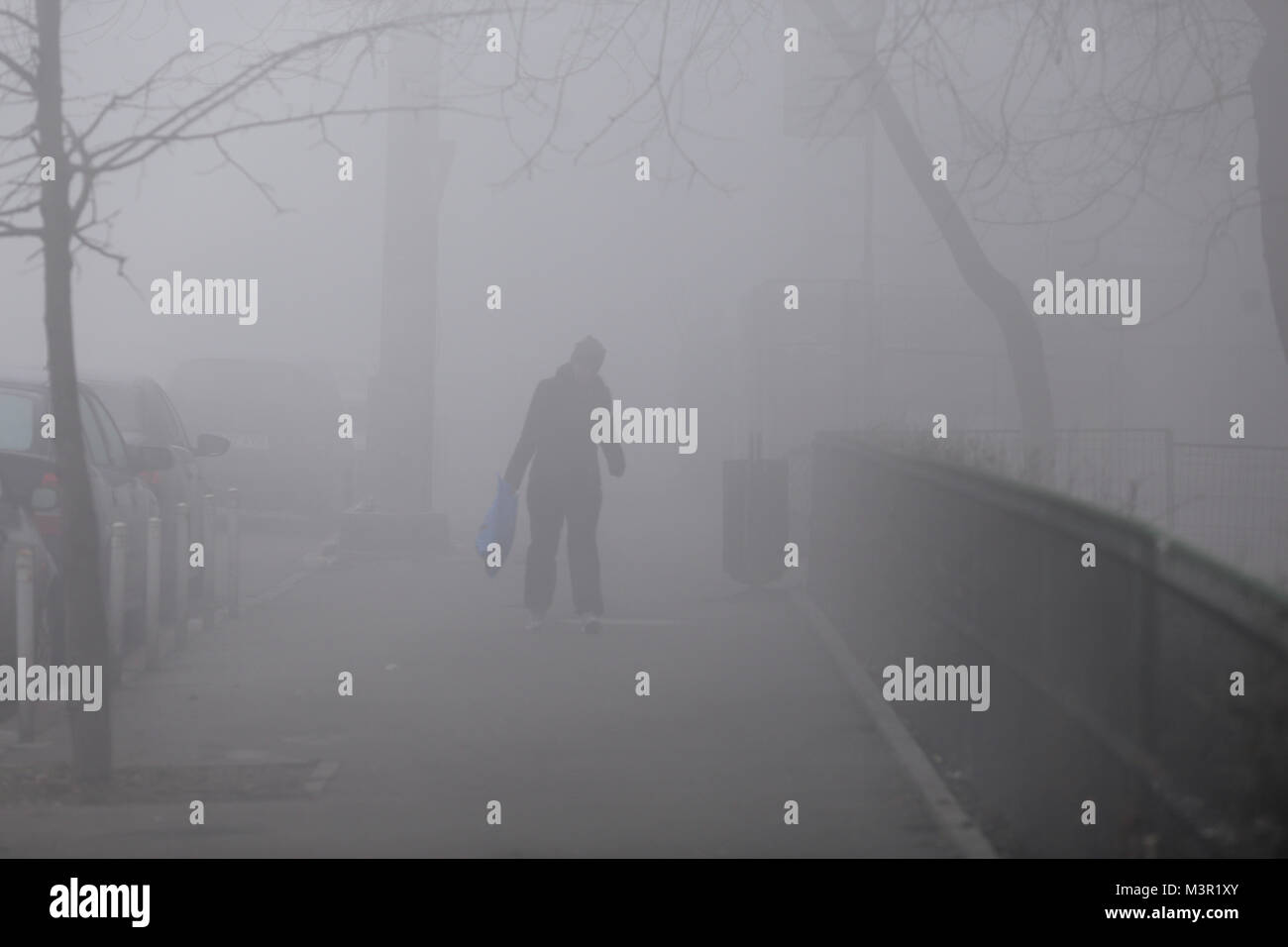 People walk in heavy fog at dawn Stock Photo - Alamy