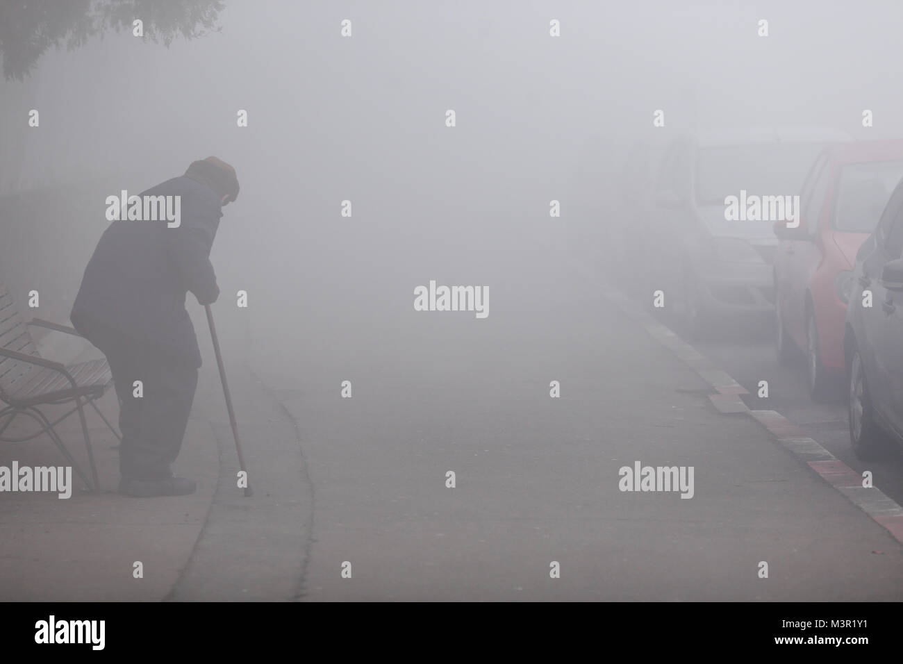 People walk in heavy fog at dawn Stock Photo - Alamy