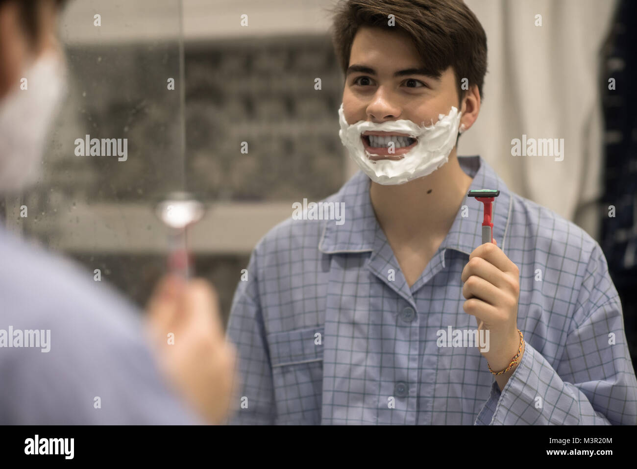 Boy Having Fun while Shaving Face Stock Photo - Alamy