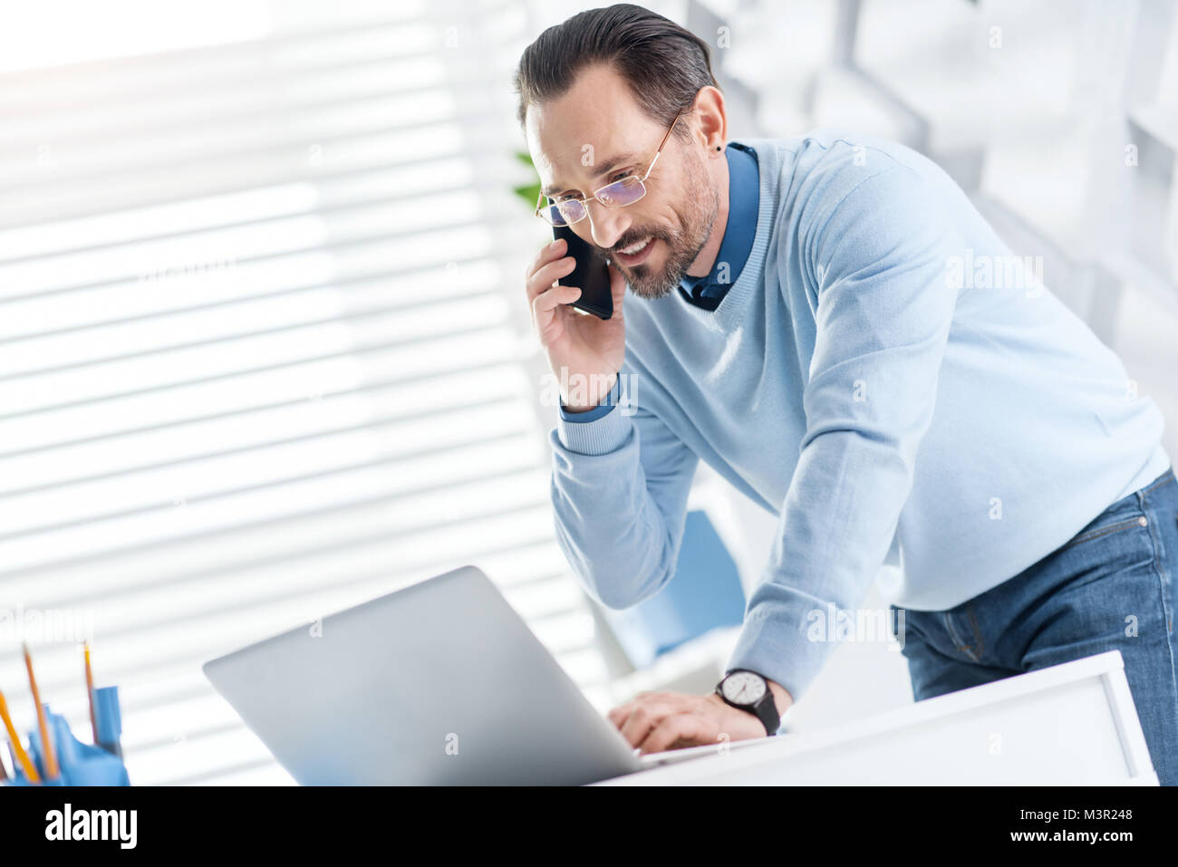 Inspired manager talking to his boss about project Stock Photo - Alamy