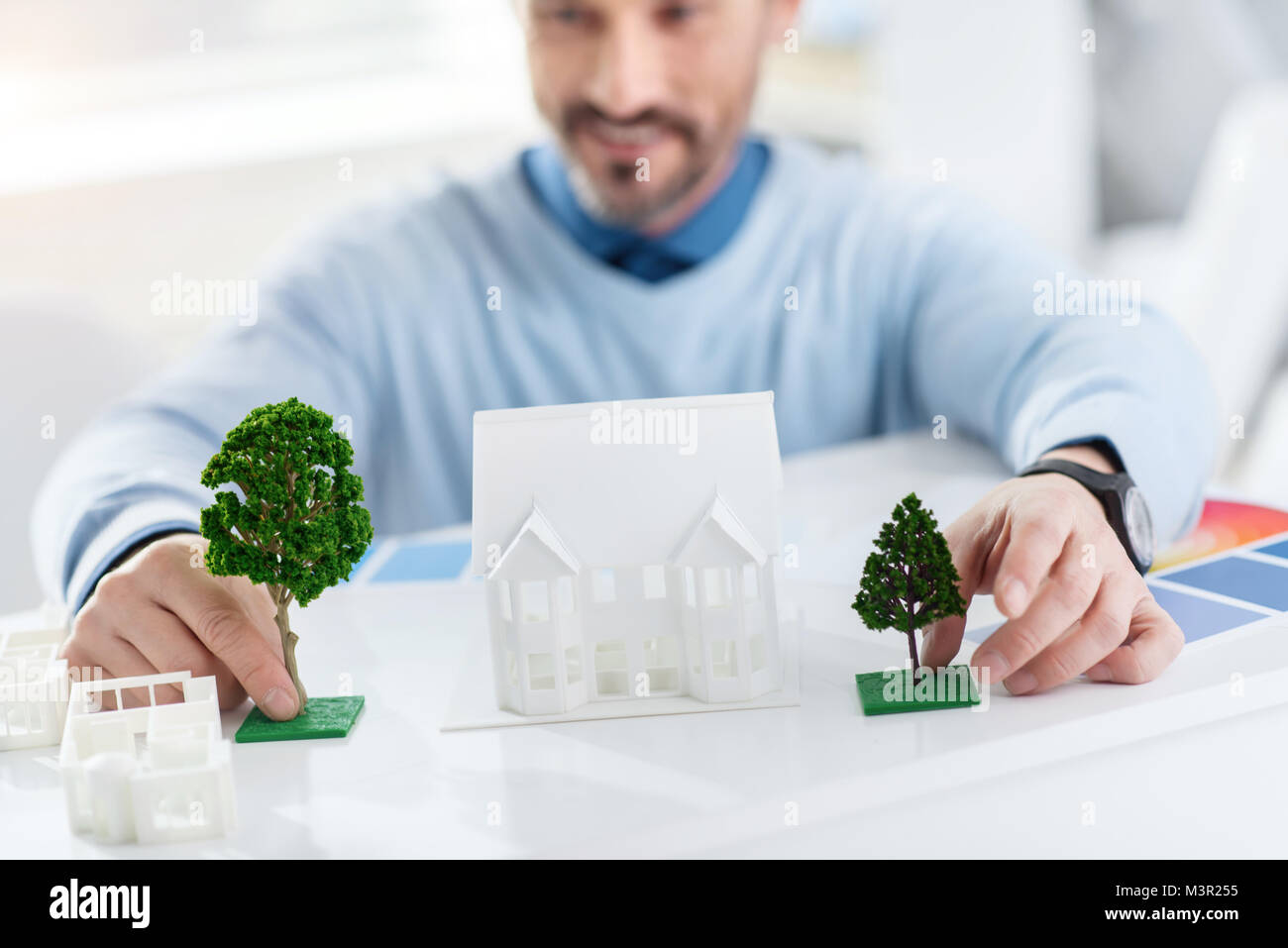 Happy architect working on his project Stock Photo - Alamy