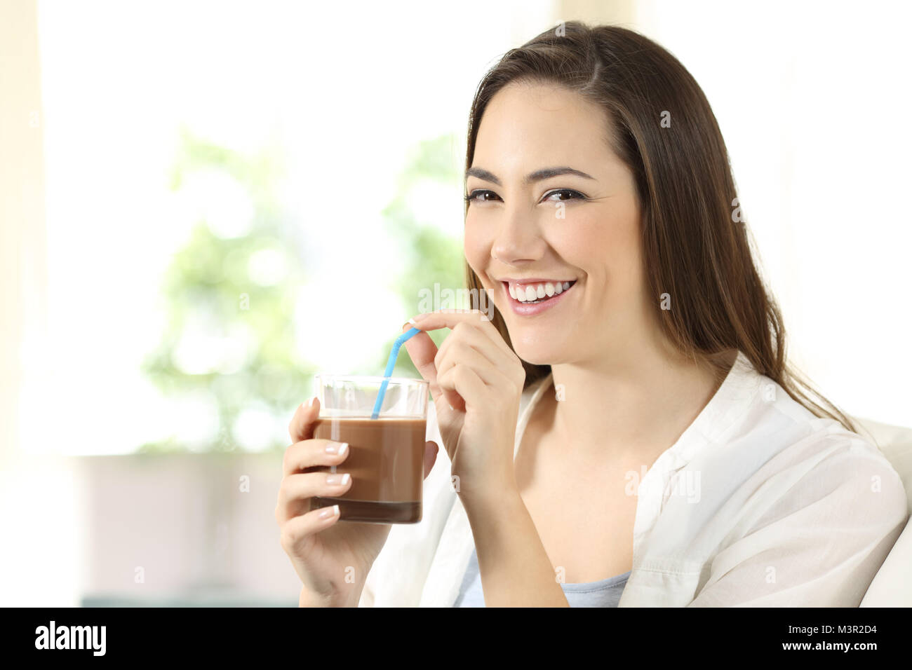 Woman drinking chocolate milk hi-res stock photography and images - Alamy