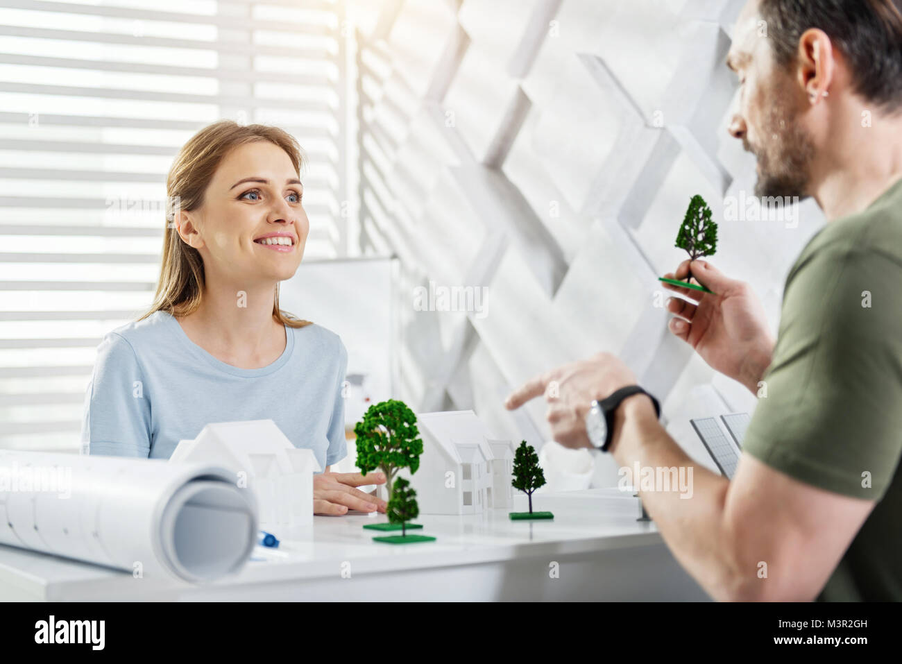 Inspired ecologist working with her colleague Stock Photo - Alamy