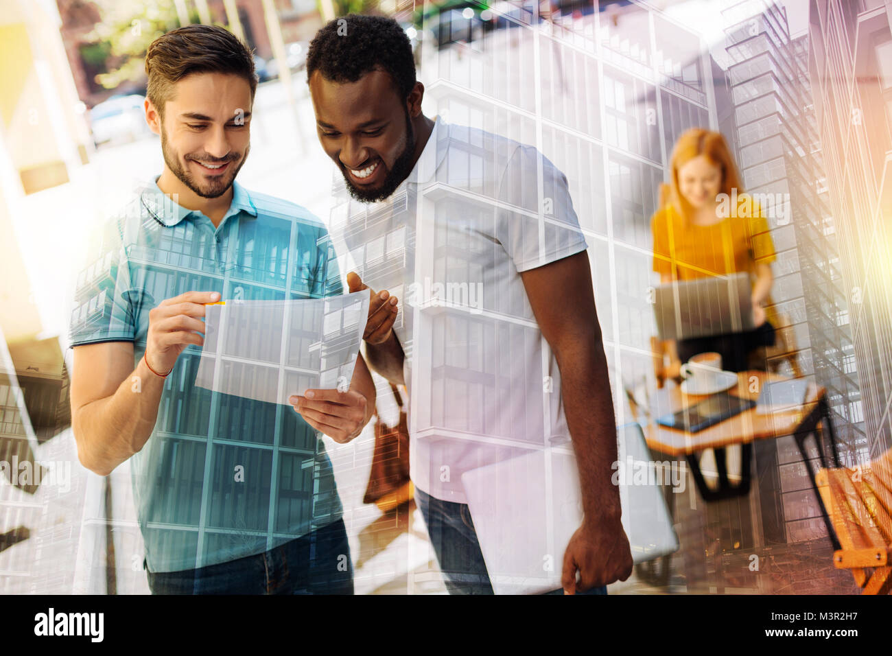 Enthusiastic employee showing his first ready project to a smiling ...