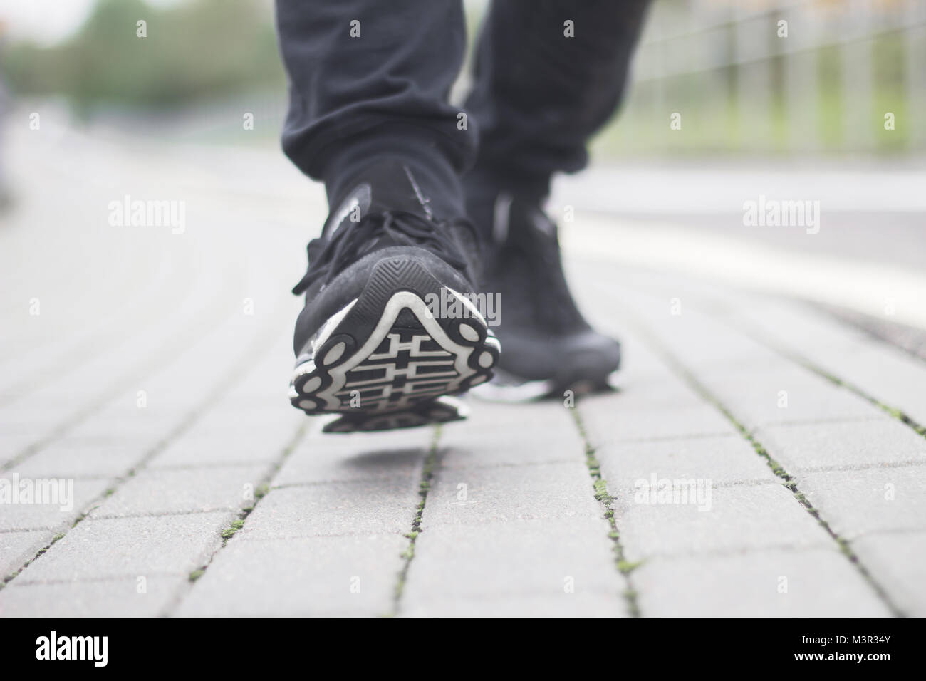 Closeup feet walking sidewalk hi-res stock photography and images - Alamy