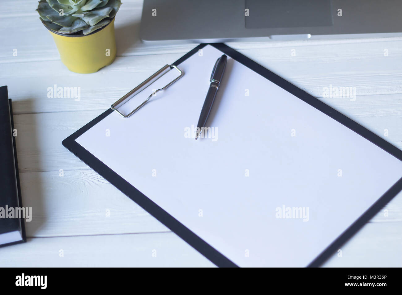 pen and a notebook at the workplace Stock Photo - Alamy