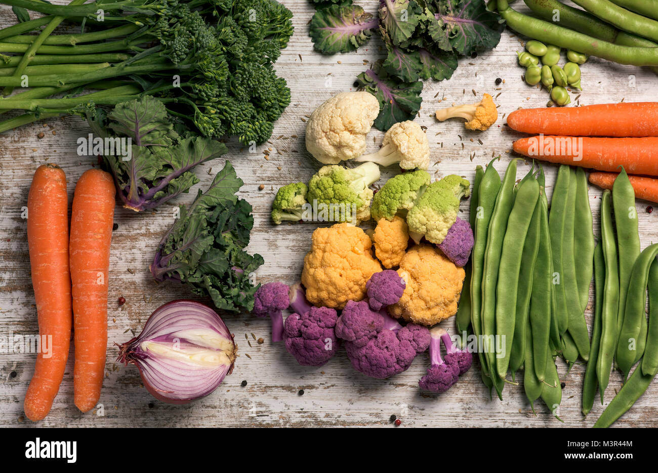 high angle shot of some different raw vegetables, such as cauliflower ...