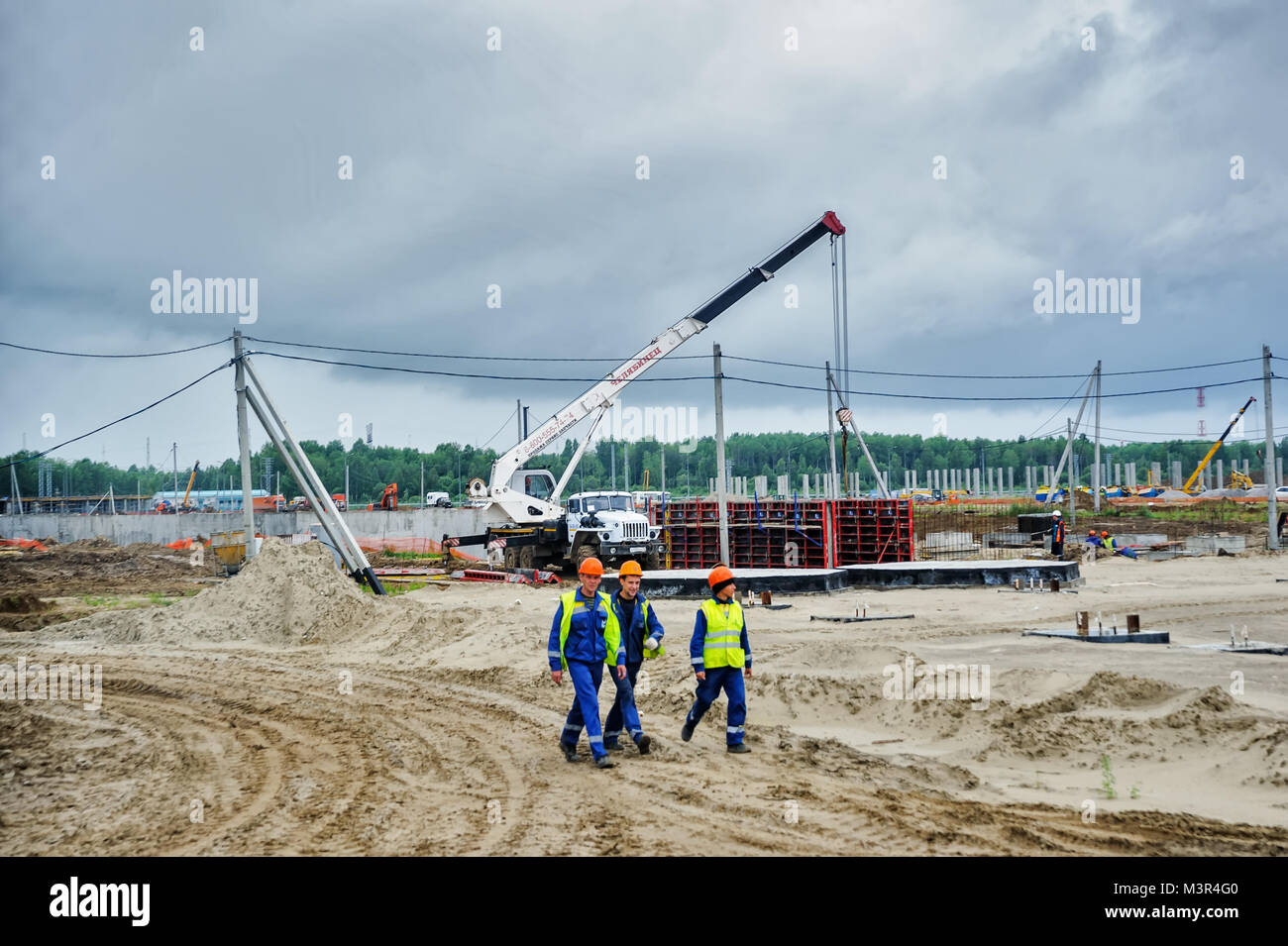 Workers on construction of plant. Tobolsk Stock Photo - Alamy