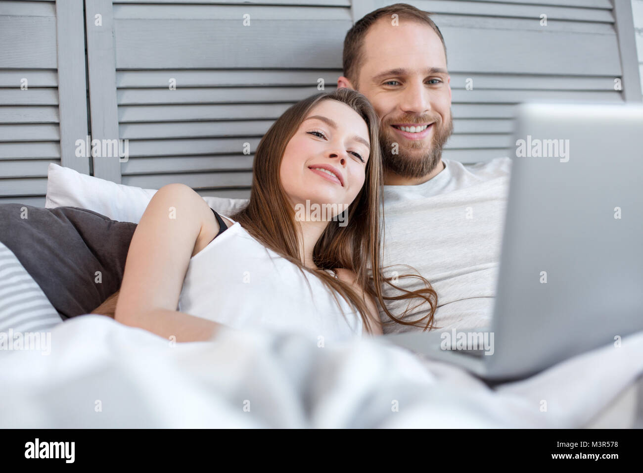 Loving couple watching a film together Stock Photo - Alamy