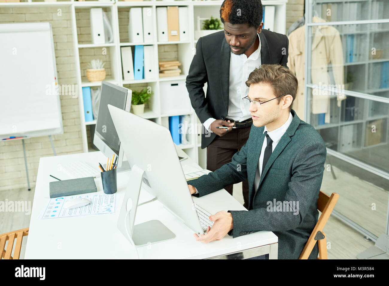 Collaborating office desk business professionals hi-res stock ...