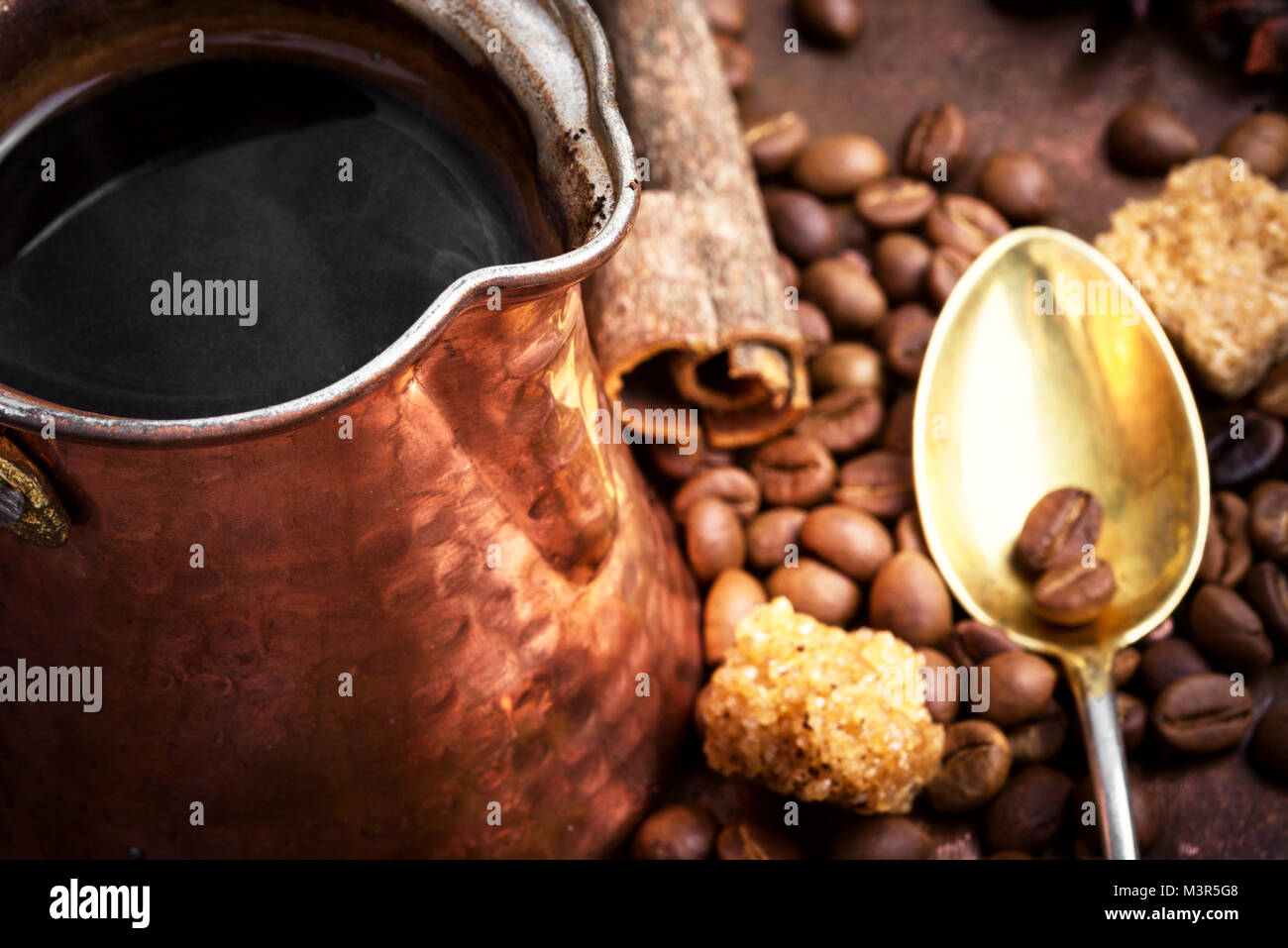 Retro bronze coffee pot with aromatic coffee.Coffee cezve.Dark key ...