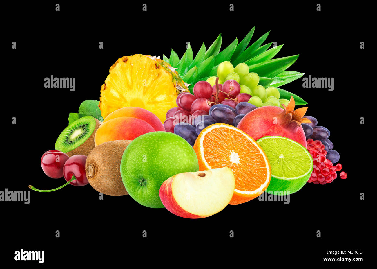 Heap of different fruits and berries isolated on black background with ...