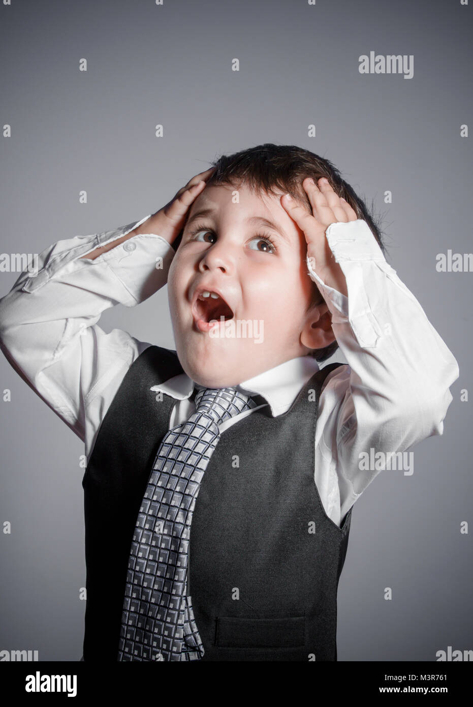 failure in business, little businessman, brown-haired boy dressed in ...